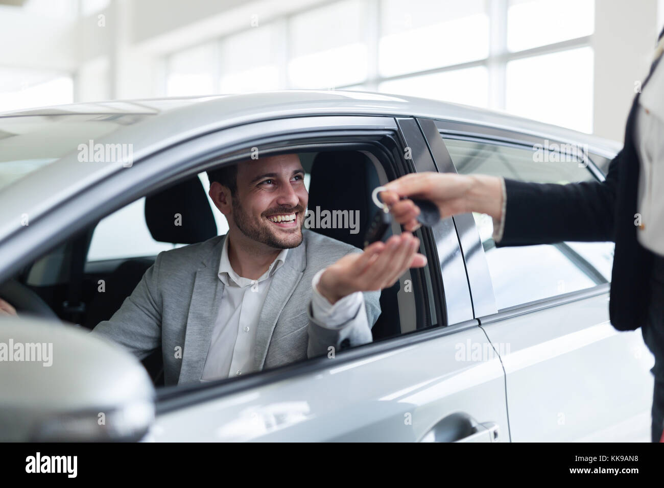 Portrait of happy customer buying new car Stock Photo - Alamy