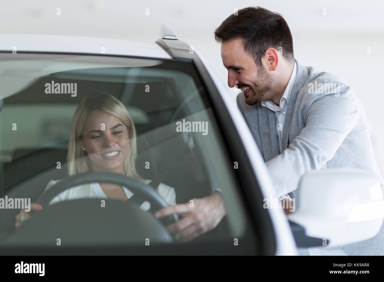 Portrait of happy customer buying new car Stock Photo - Alamy