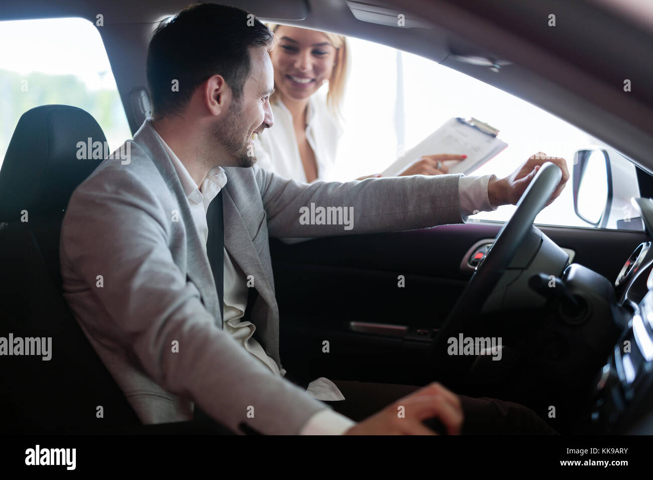 Portrait of happy customer buying new car Stock Photo - Alamy