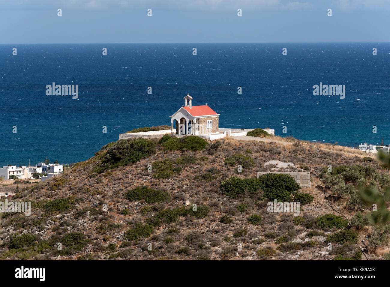 Greek chapel on a hill facing the Cretan Sea near Sisi a small seaside ...