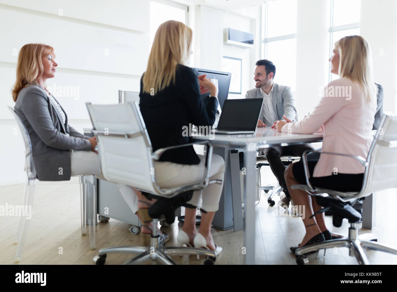 Picture of attractive sales workers on meeting in office Stock Photo ...
