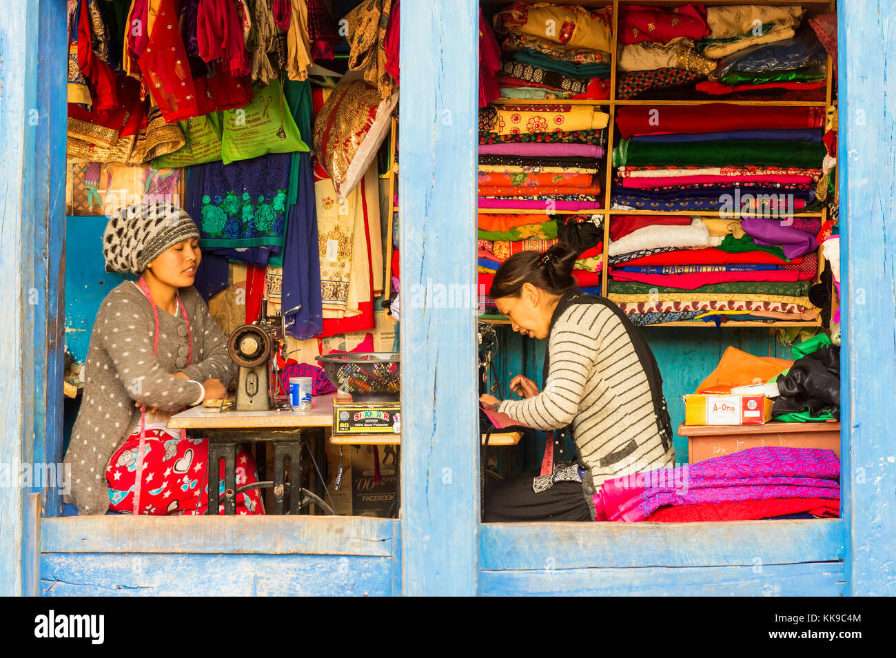 Young Nepalese women working in an open Tailor shop in Bandipur ...