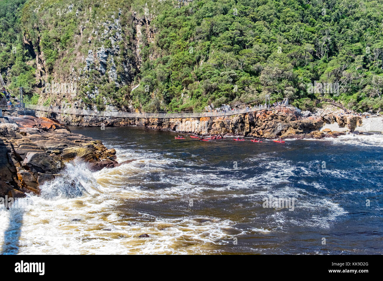Tsitsikamma storms river suspension bridge with people kayaking under ...
