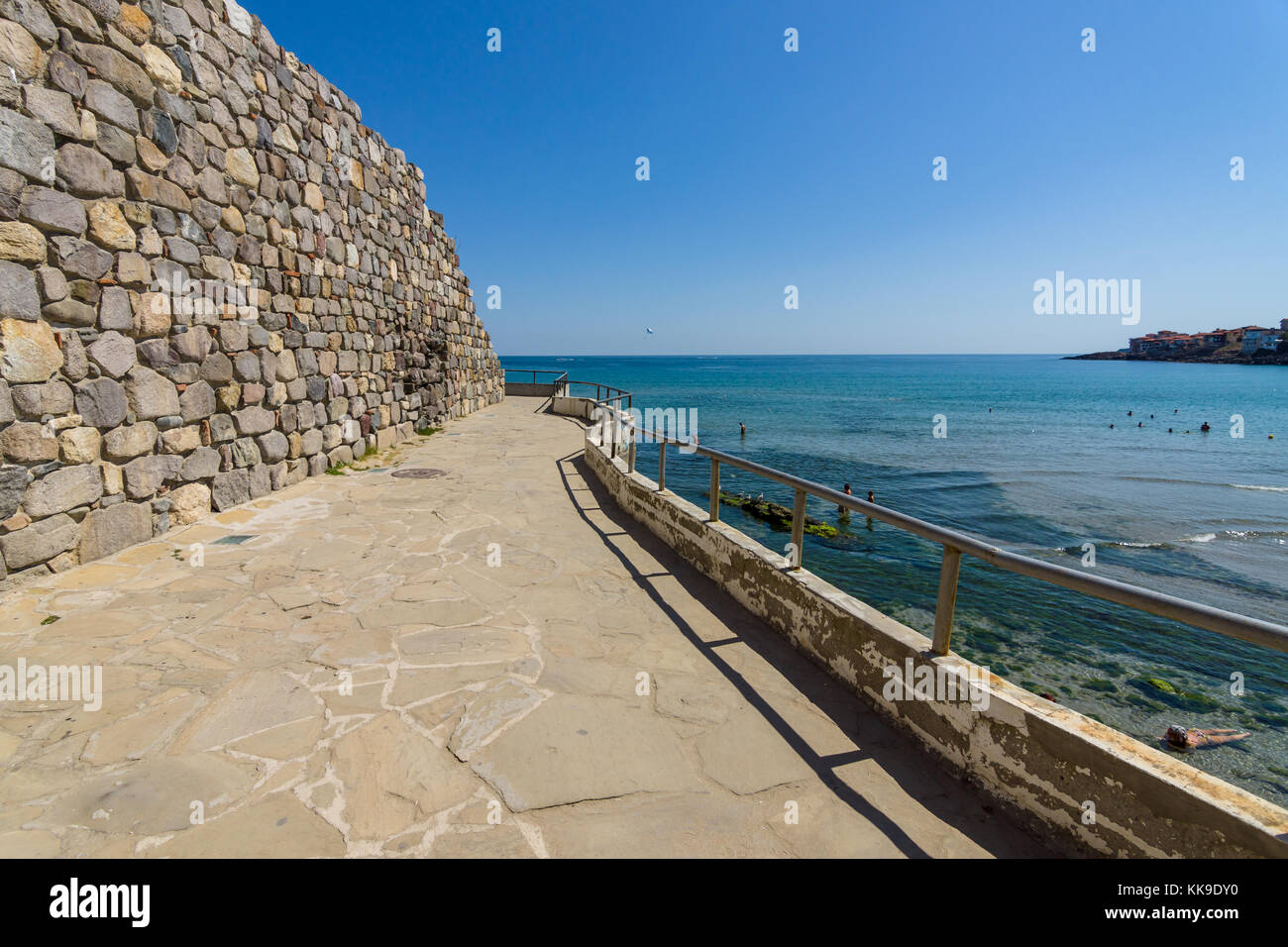 Promenade along the old fortress wall of the ancient seaside town of ...