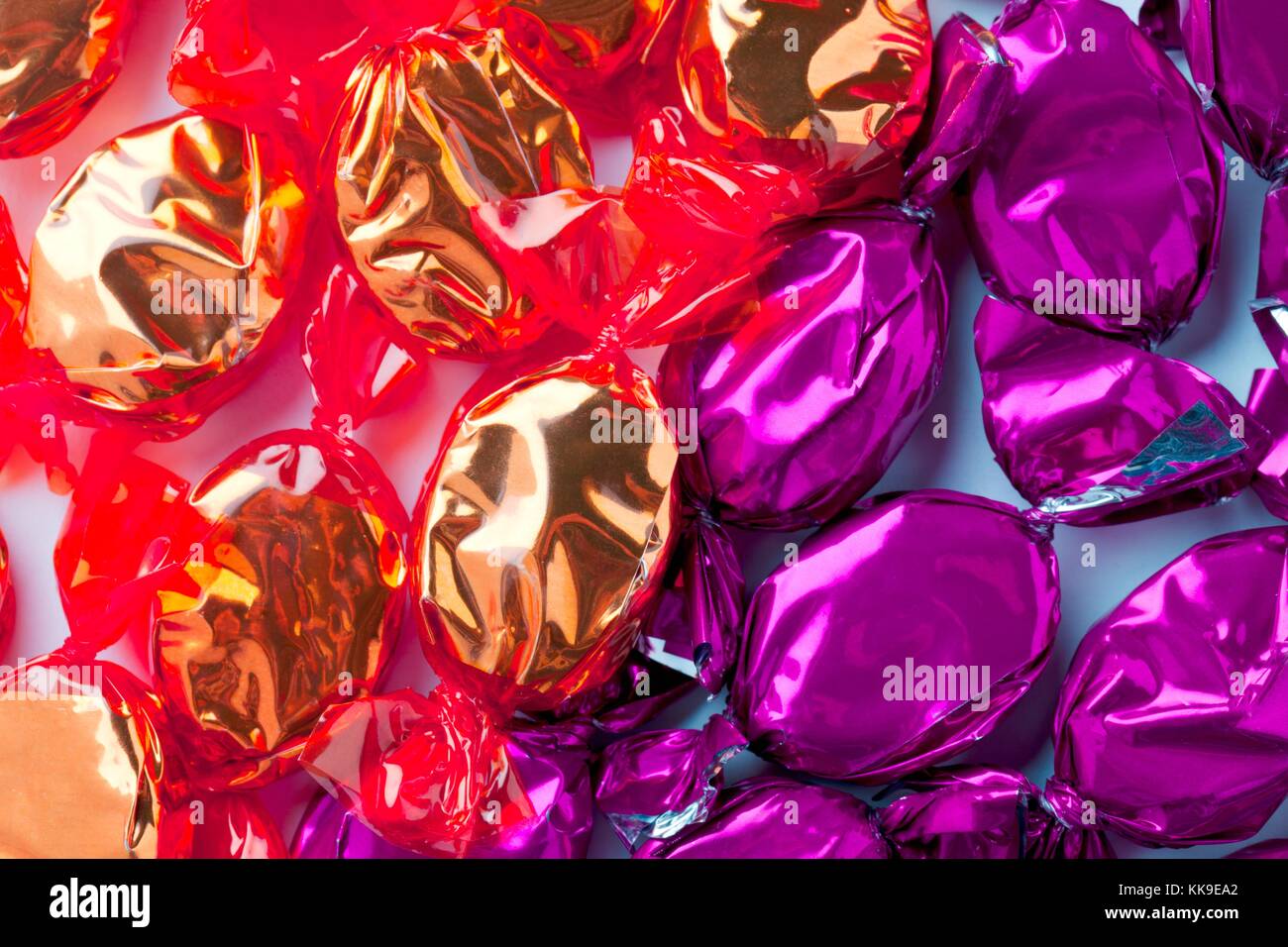 close up shot of golden and purple hard candies Stock Photo - Alamy