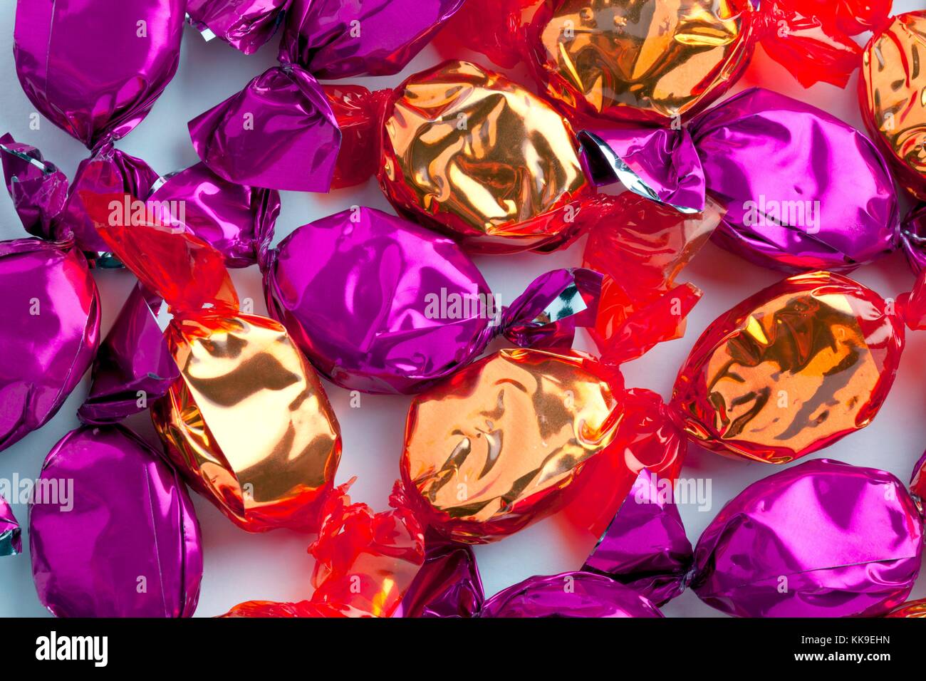 extreme close up shot of golden and purple hard candies Stock Photo - Alamy