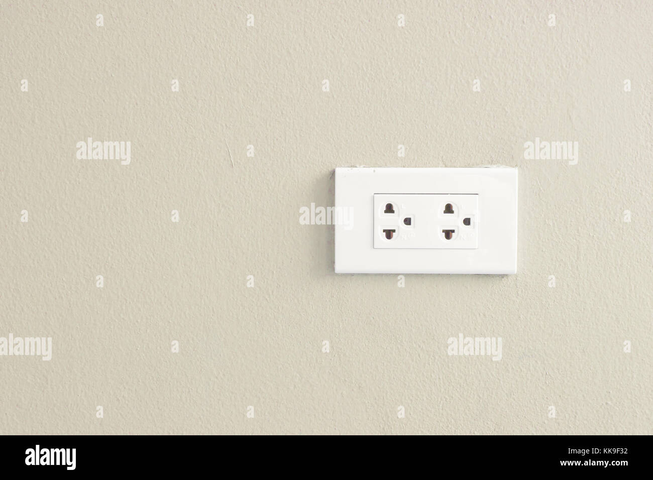 White electric plugs on wall background,White outlet interior, interior ...