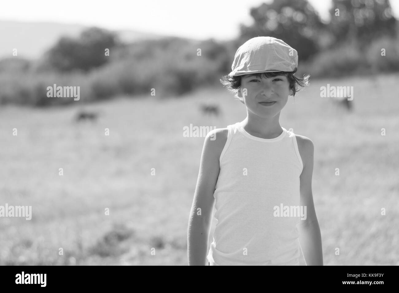 Portrait of a nice boy in a T-shirt and cap. Black and white Stock ...