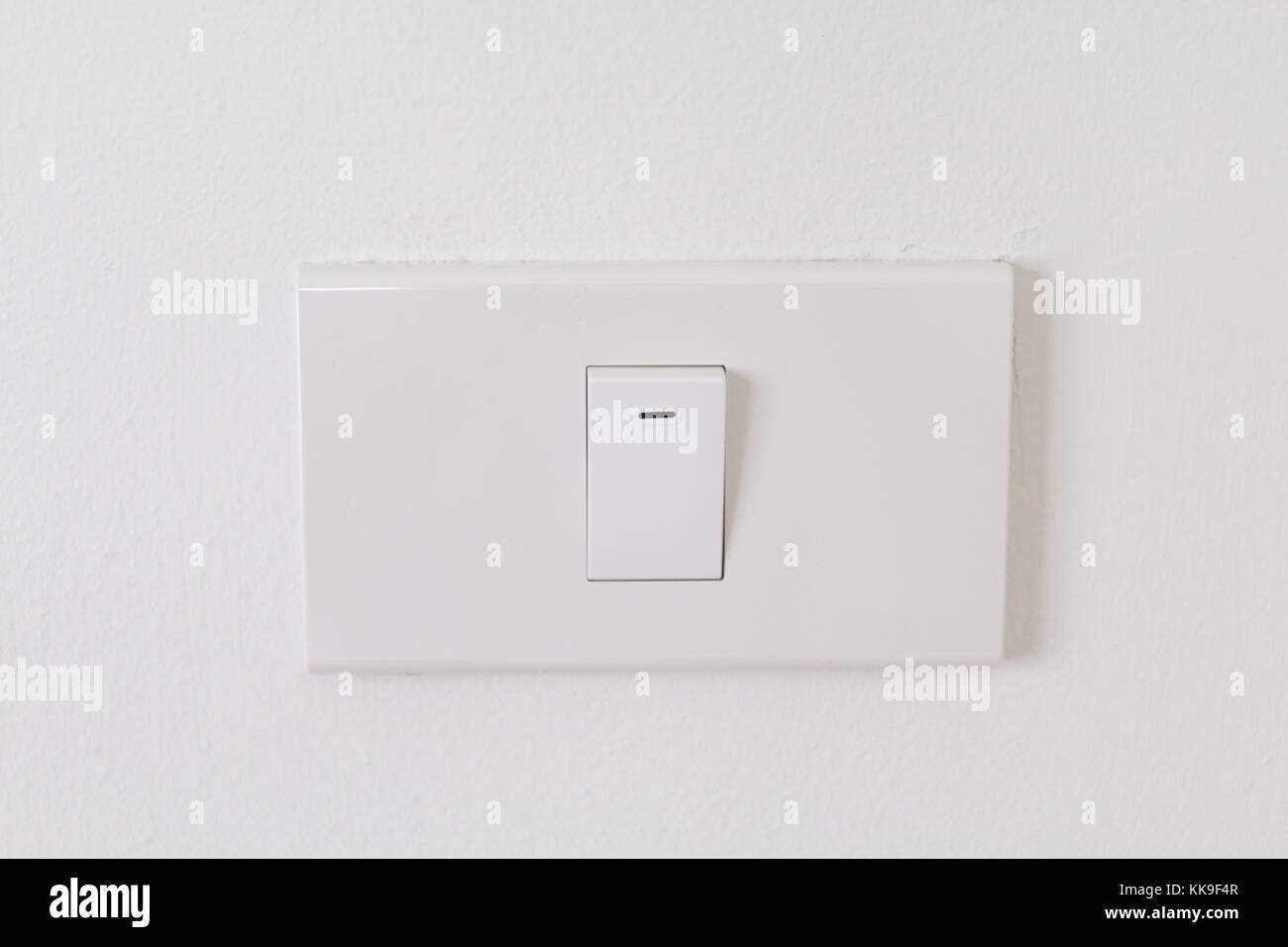 Electronic switches with white background, White switches on wall in ...