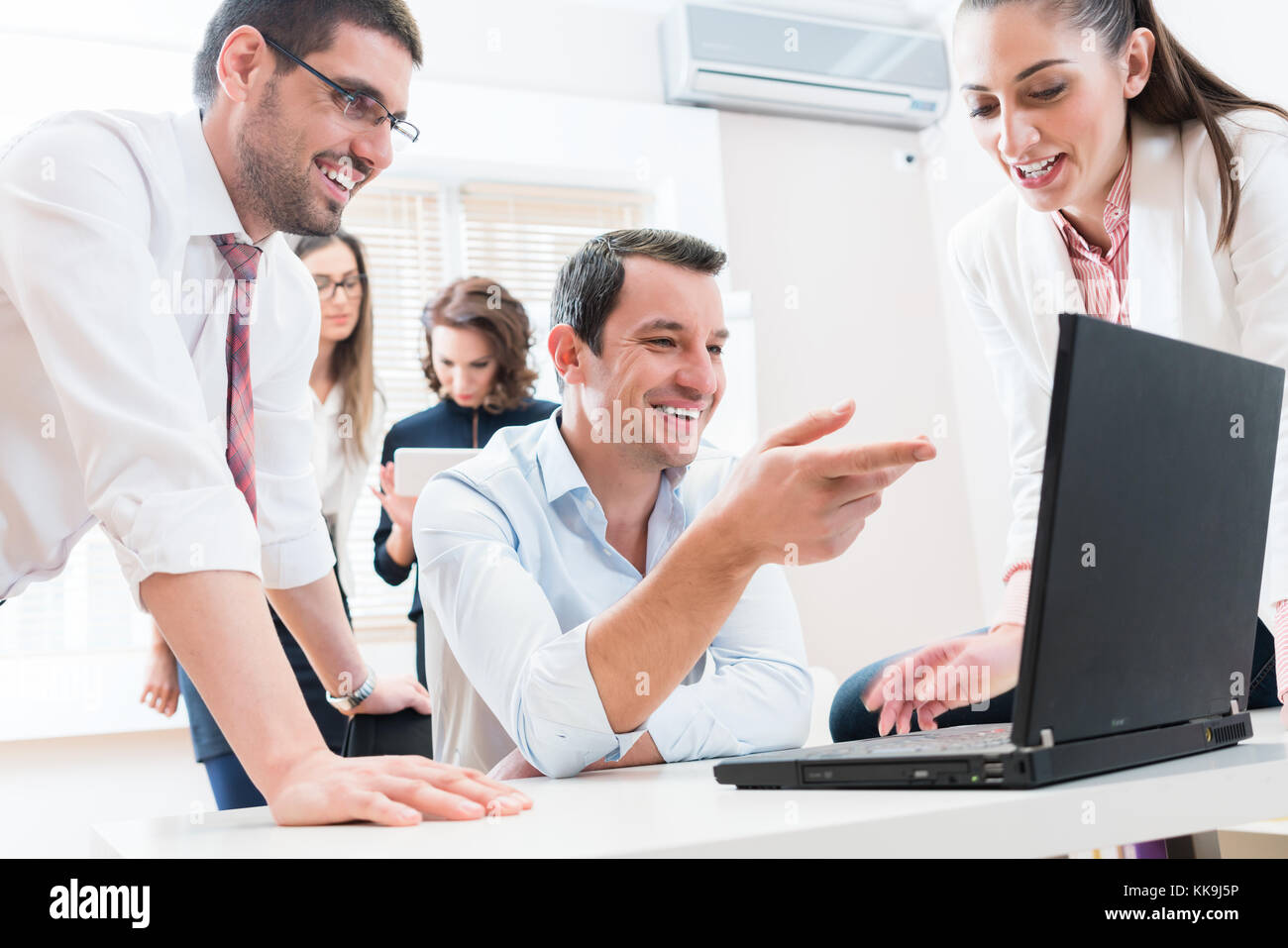 Business team reporting to boss having meeting in office discussing ...