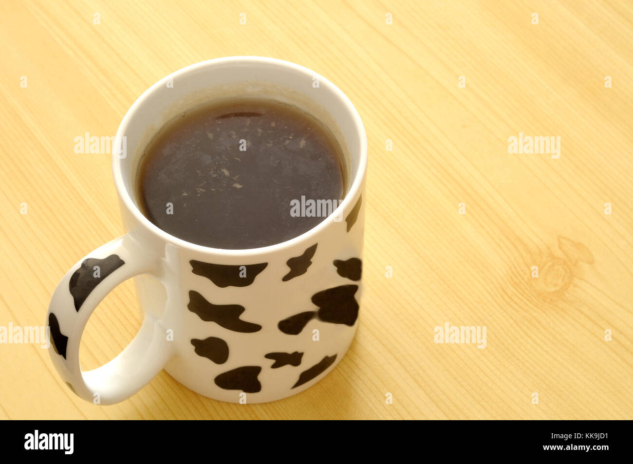 spotted cup with green tea Stock Photo - Alamy
