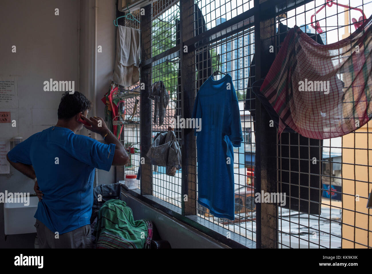 Migrant construction workers in their hostel in Singapore Stock Photo ...
