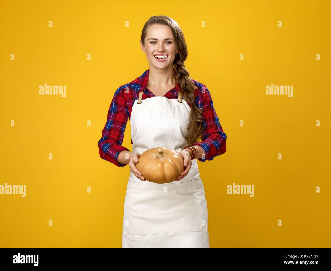 Healthy food to your table. Portrait of happy modern woman cook wearing ...