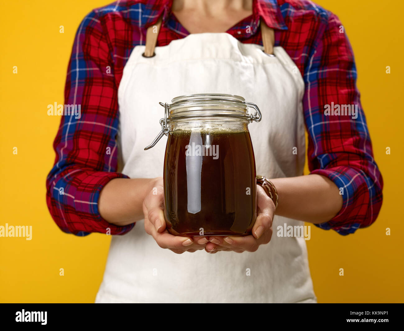 Healthy food to your table. Closeup on modern woman cook wearing apron ...