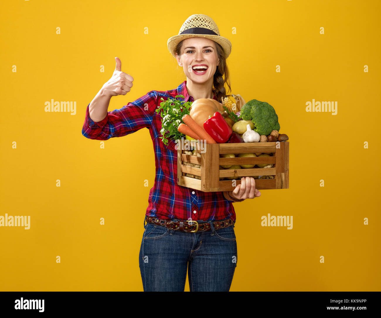 Healthy food to your table. Portrait of smiling young woman grower in ...