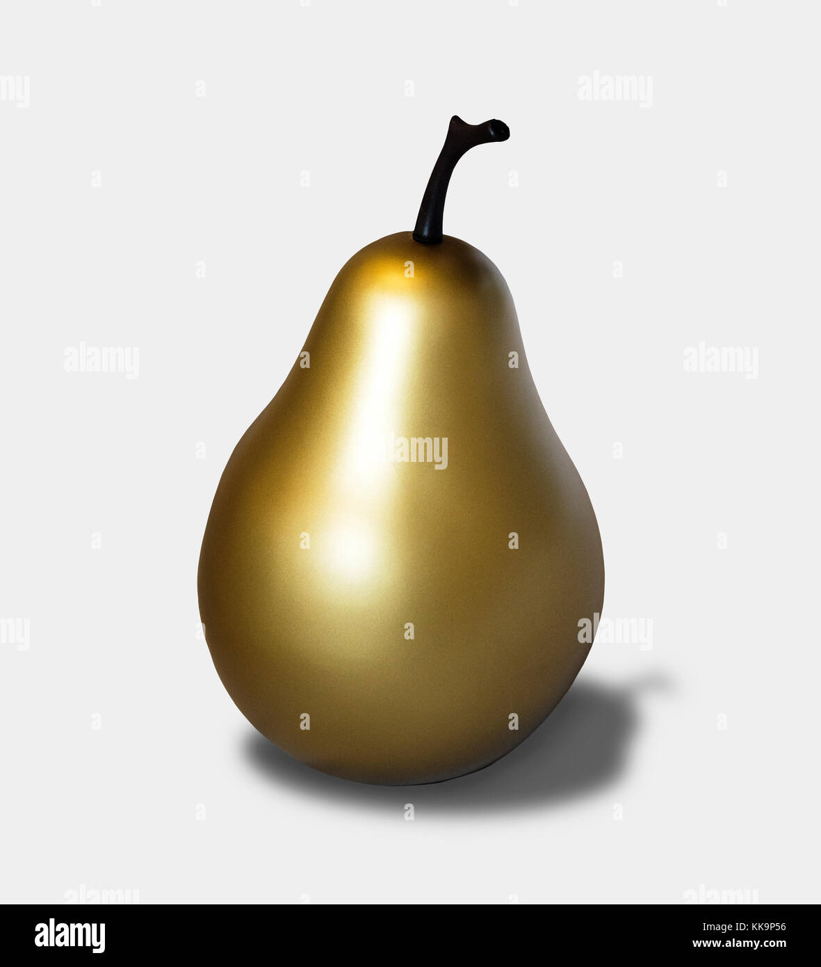 Gold pear on 18 percent gray background with shadow Stock Photo - Alamy