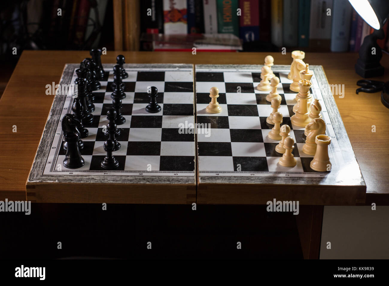chess board from the side with multiple moves made game Stock Photo - Alamy