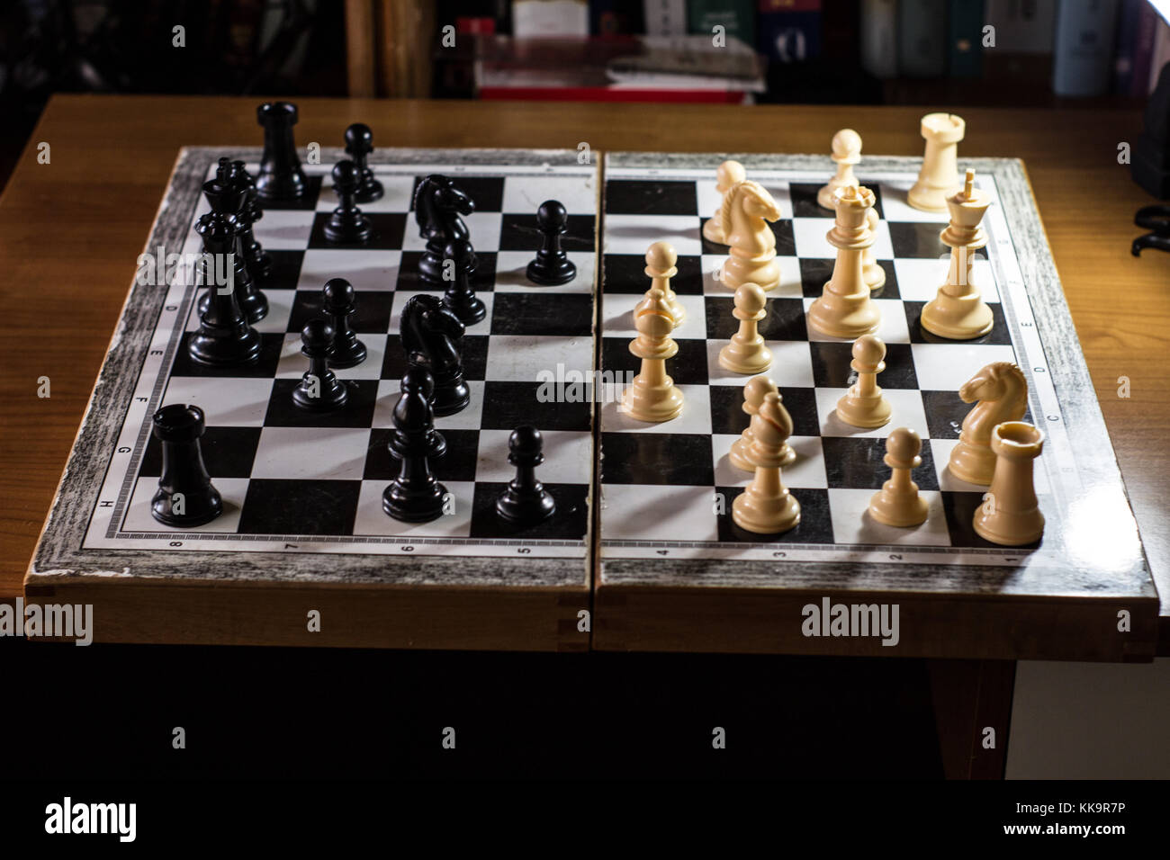chess board from the side with multiple moves made game Stock Photo - Alamy