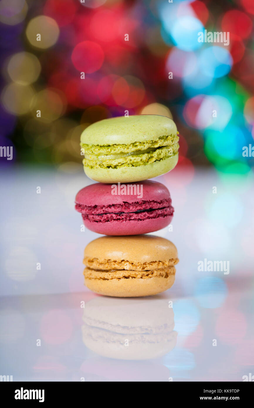 Colorful macaroons in a plate over white Stock Photo - Alamy
