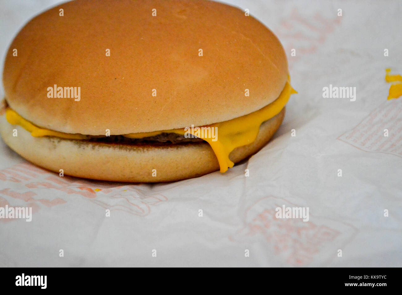 Homemade tasty cheeseburger at white paper Stock Photo - Alamy