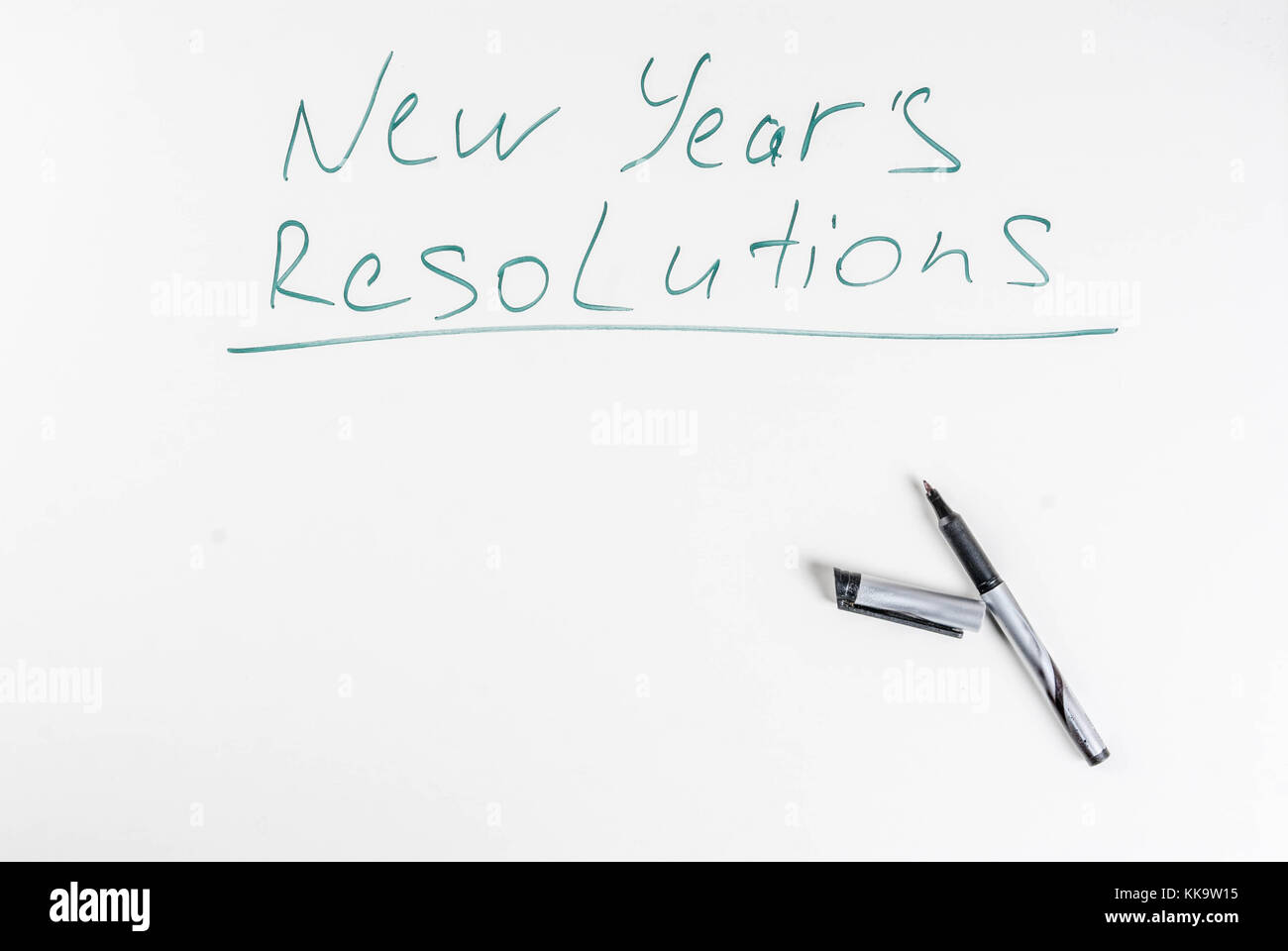 New years resolutions, white board background with pen, copy space ...