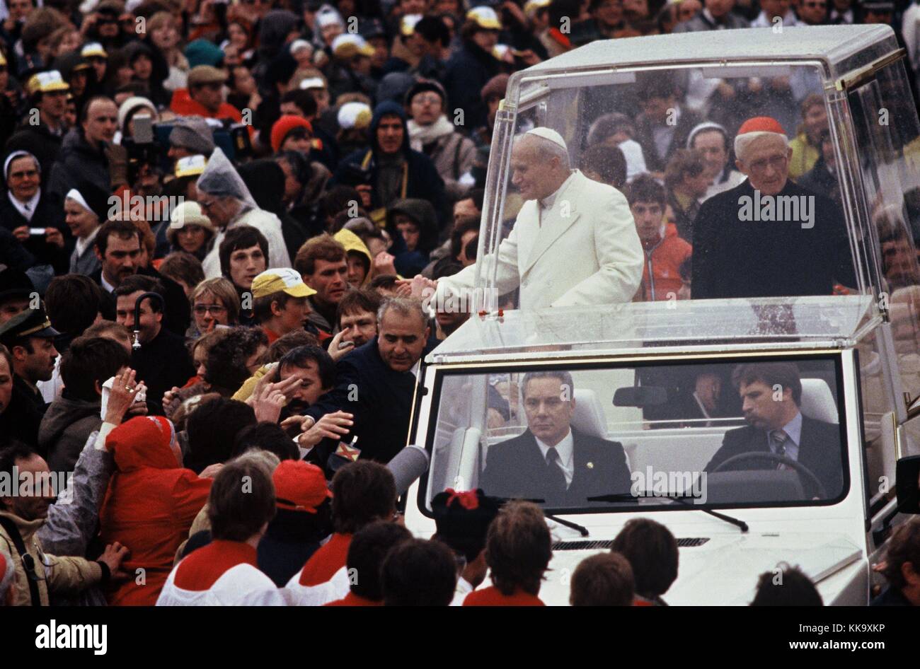 Pope John Paul II in his popemobile driving through Cologne where he ...
