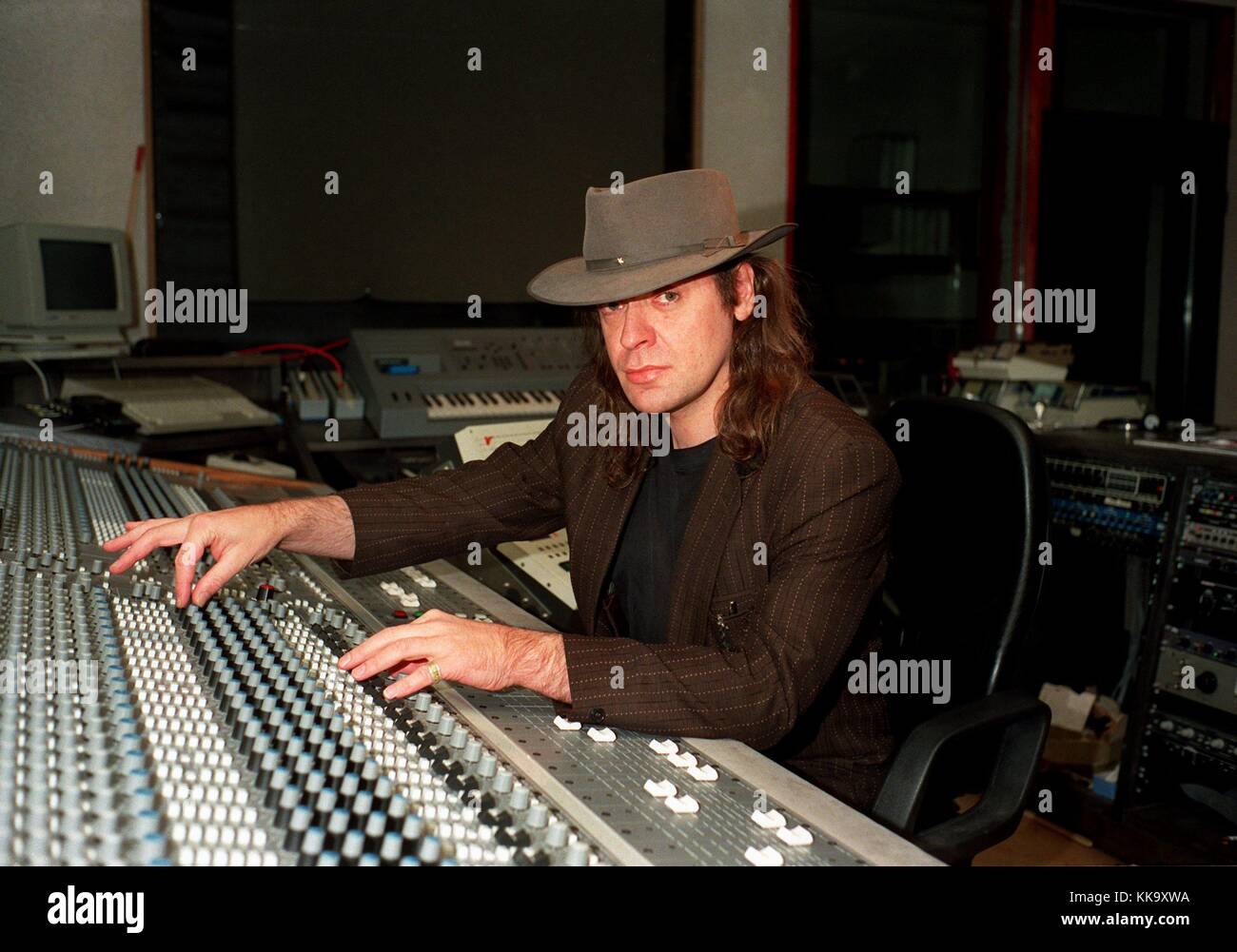 German rock musician Udo Lindenberg sits at the mixing console of a ...