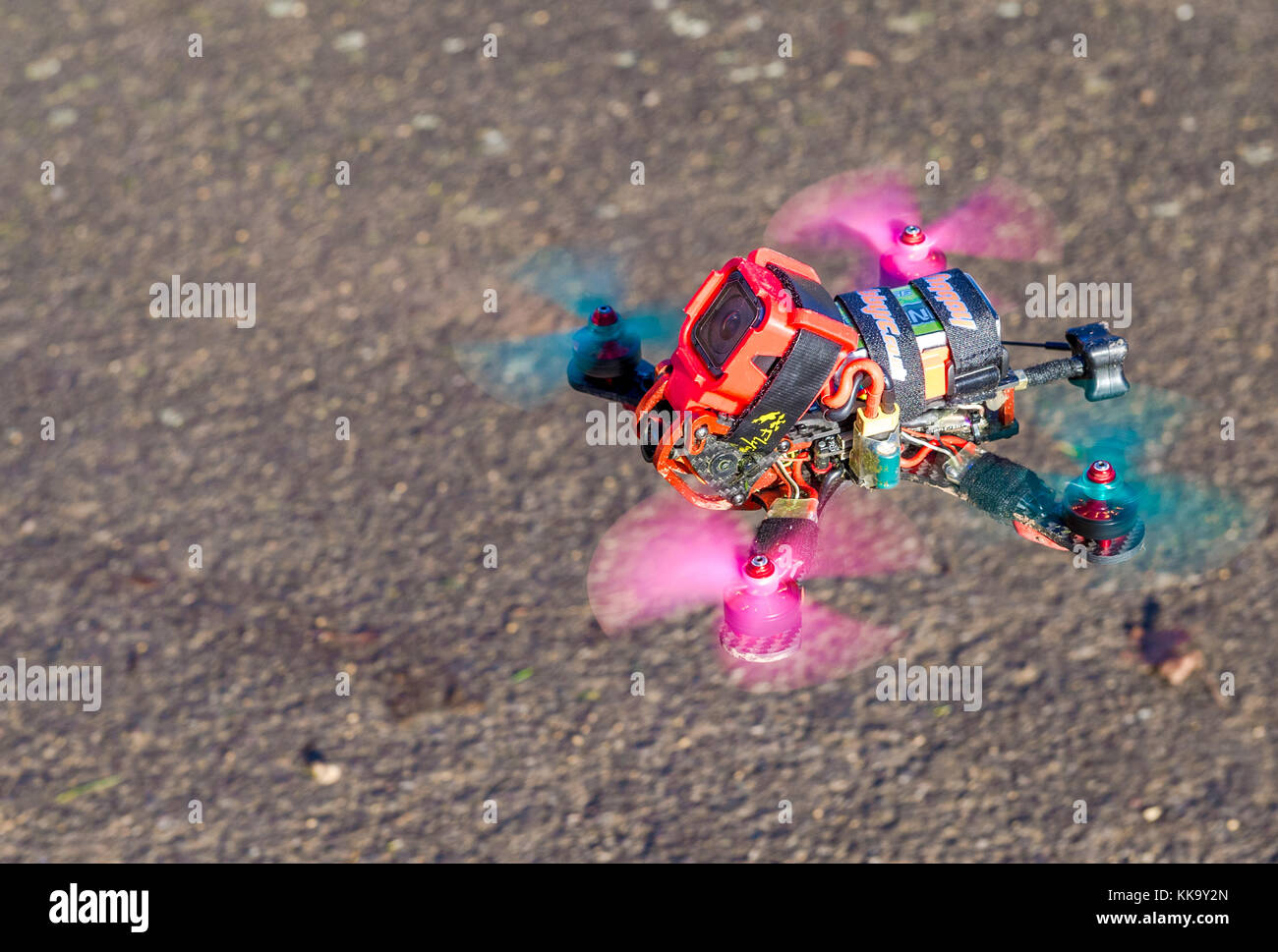 Small hand built drone hovering close to the ground Stock Photo - Alamy