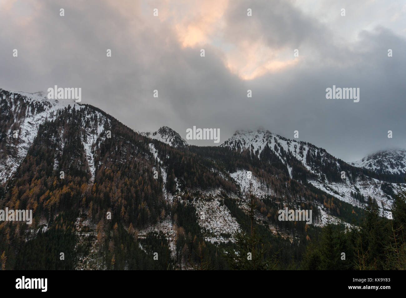 Sunset on a very cloudy day in the Austrian Alps Stock Photo - Alamy