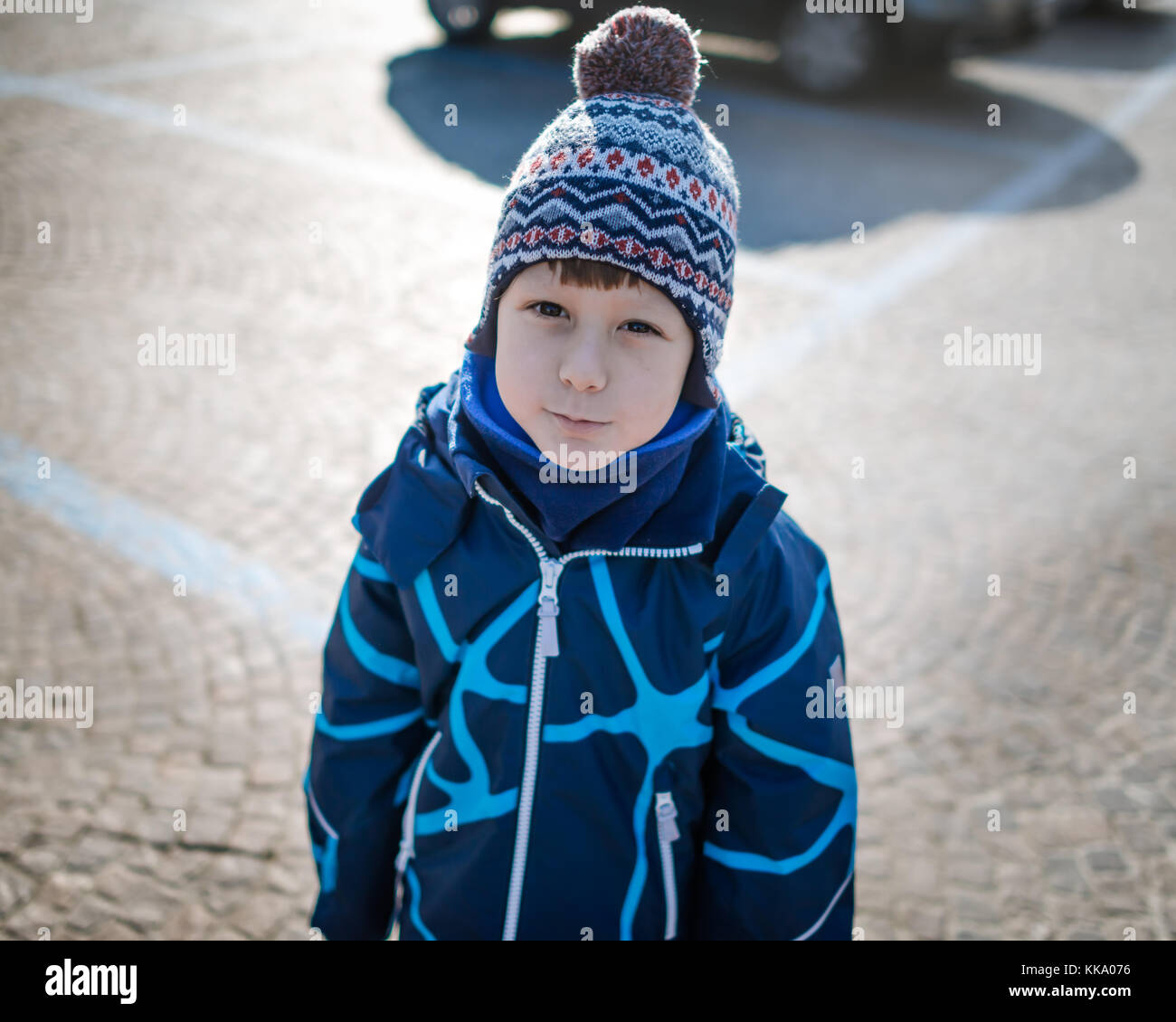 Cute young boy staying outdoor and keep calm in winter time Stock Photo ...