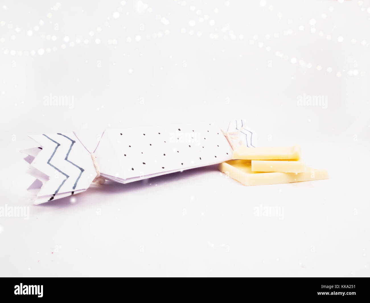 Christmas Decoration with white cracker box with golden bokeh and snow ...