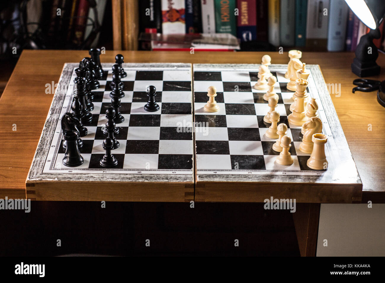 chess board from the side with multiple moves made game Stock Photo - Alamy