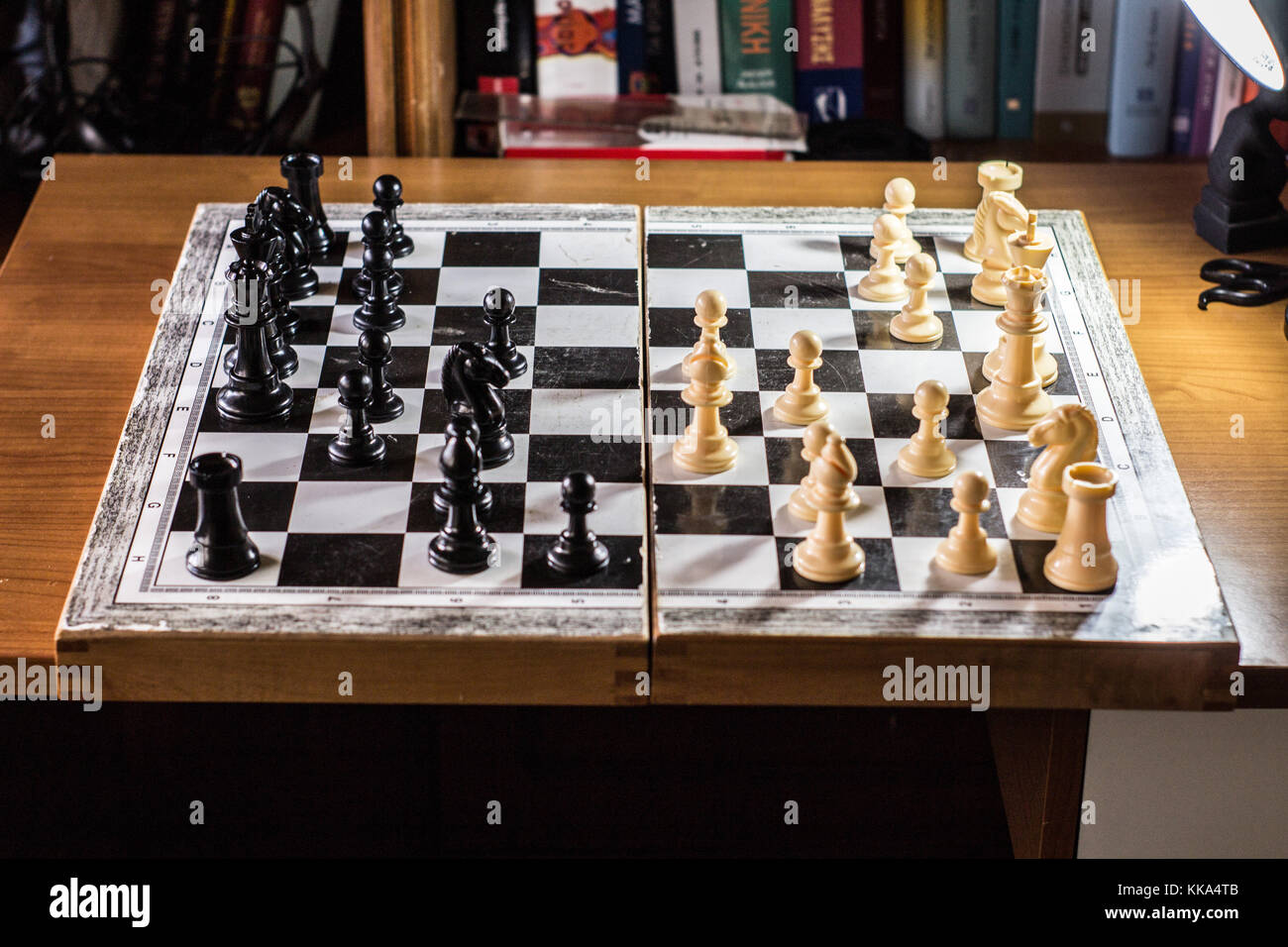 chess board from the side with multiple moves made game Stock Photo - Alamy