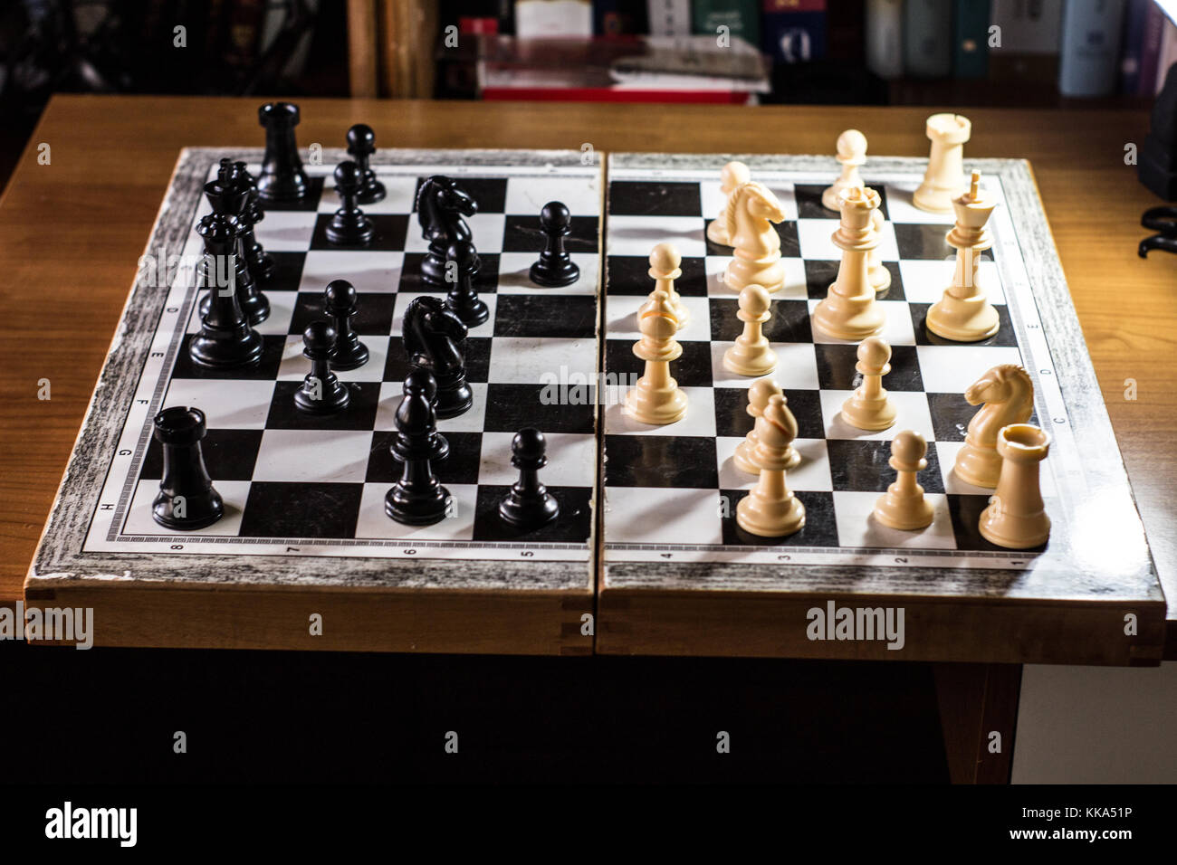 chess board from the side with multiple moves made game Stock Photo - Alamy
