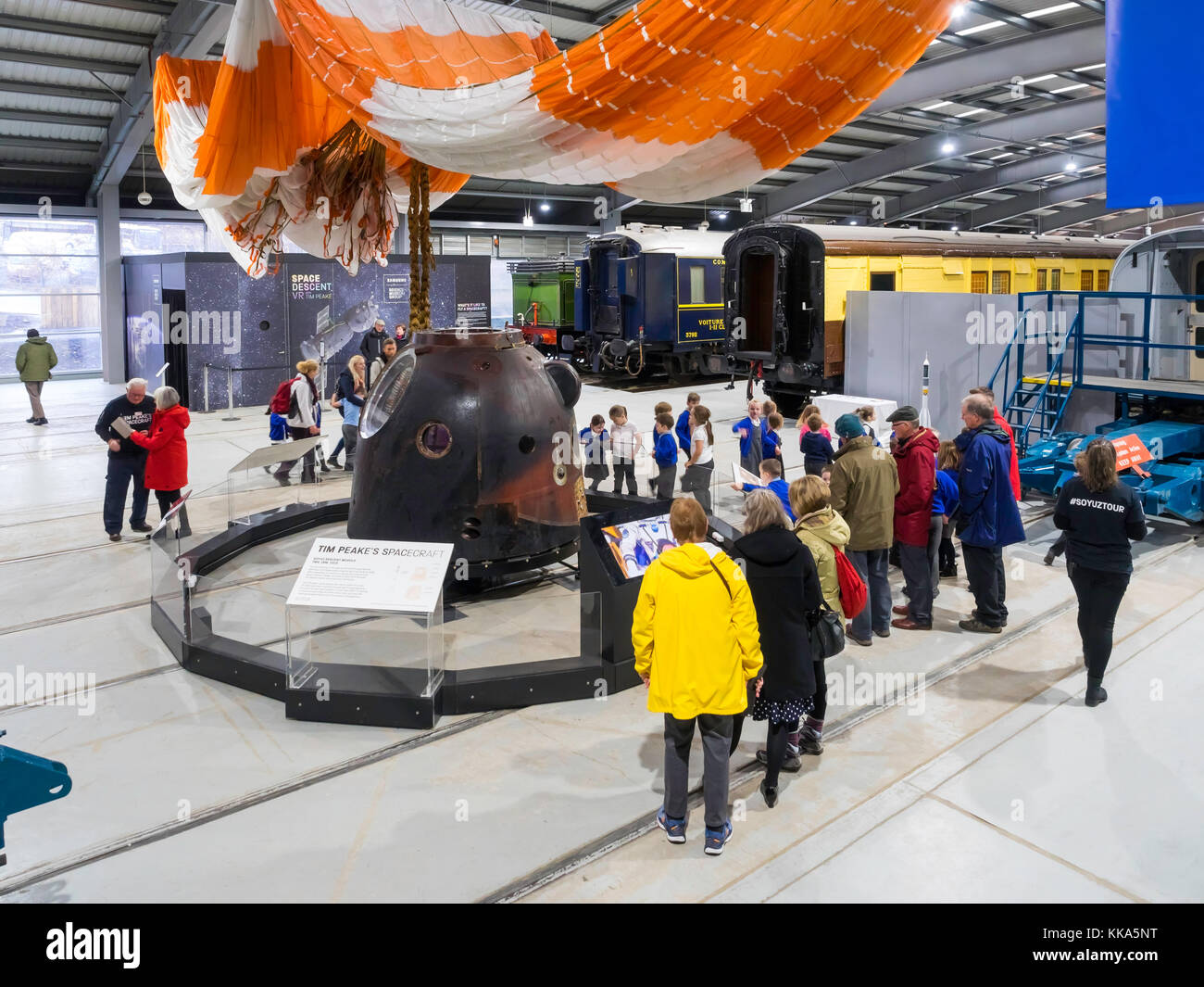 Crowd of people and children viewing Soyuz Descent Module TMA-19M which ...