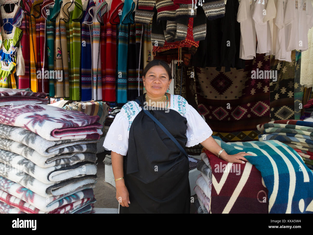 Woman stall holder and her textile stall, Otavalo Market, Ecuador South ...