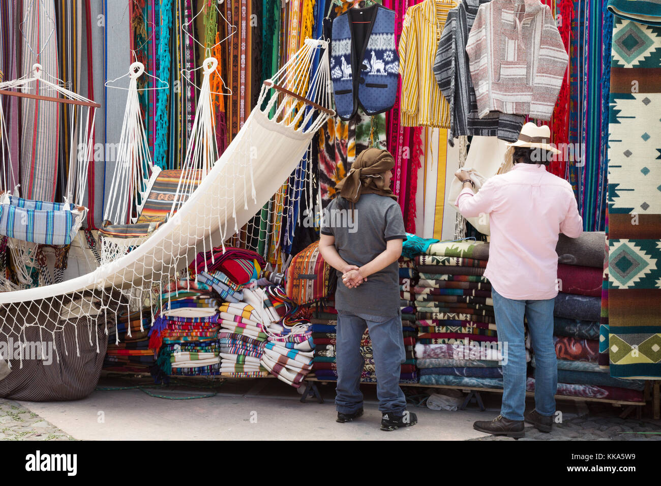 Ecuador market - people shopping at a market stall, Otavalo Market ...