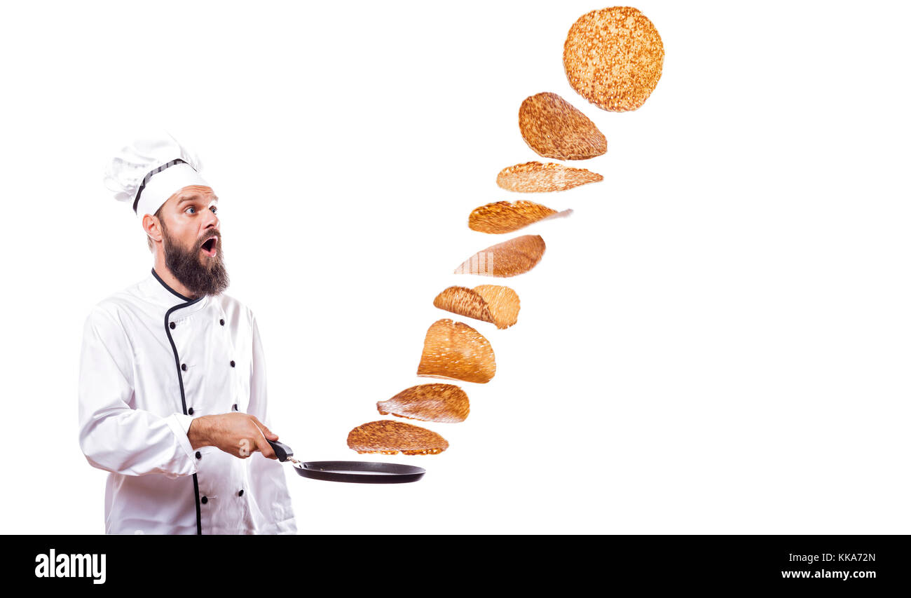 man chef is flipping crepes in the air using a frying pan Stock Photo ...