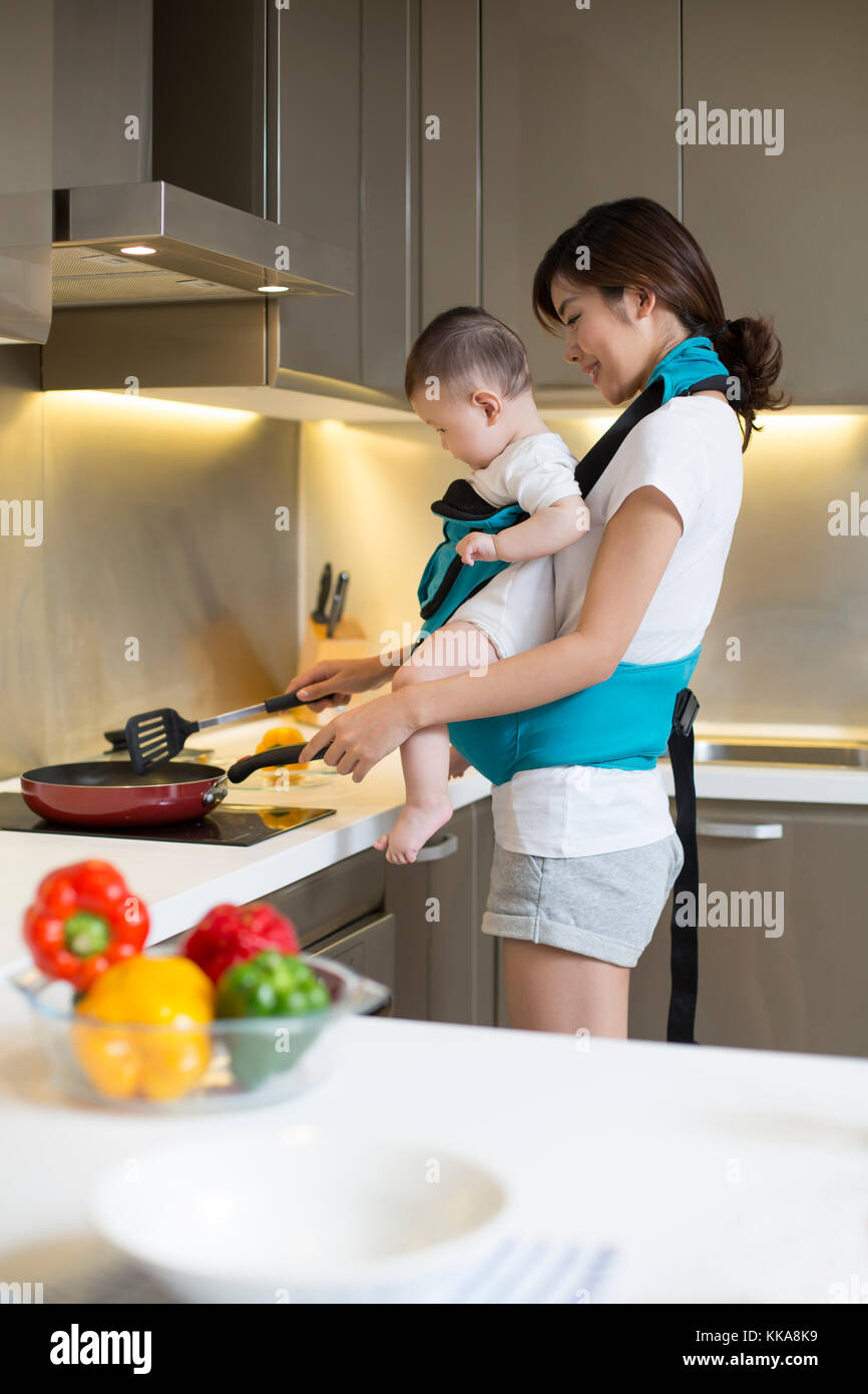 Asian mother and baby with fan hi-res stock photography and images - Alamy