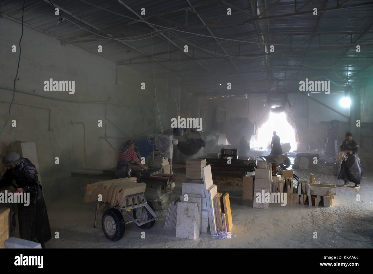 A stone workshop in Syria where local sawyers and banker masons cut the ...