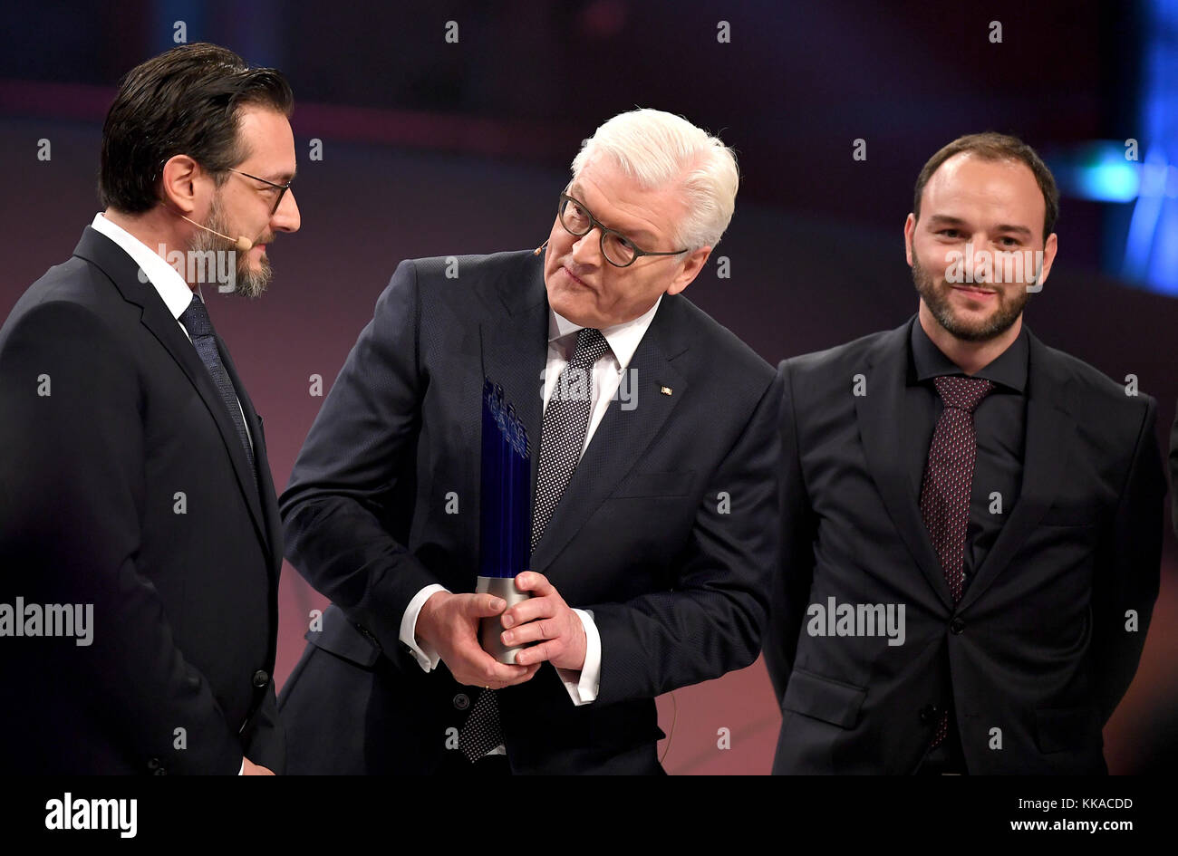 German President Frank-Walter Steinmeier (c) hands over the German ...