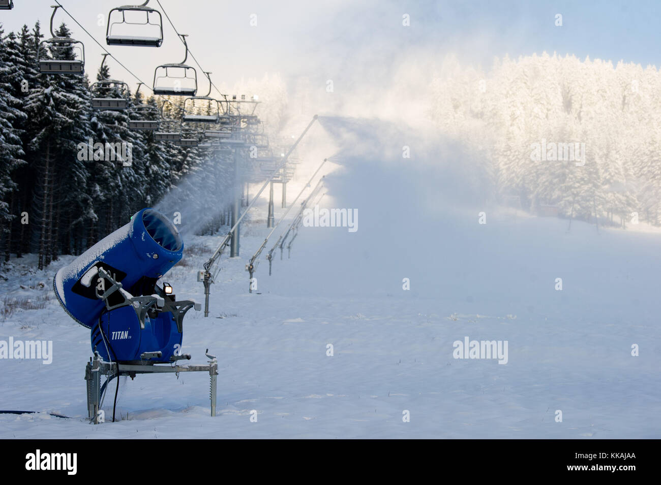 A snow cannon and a so-called snow lance standing behind spraying ...