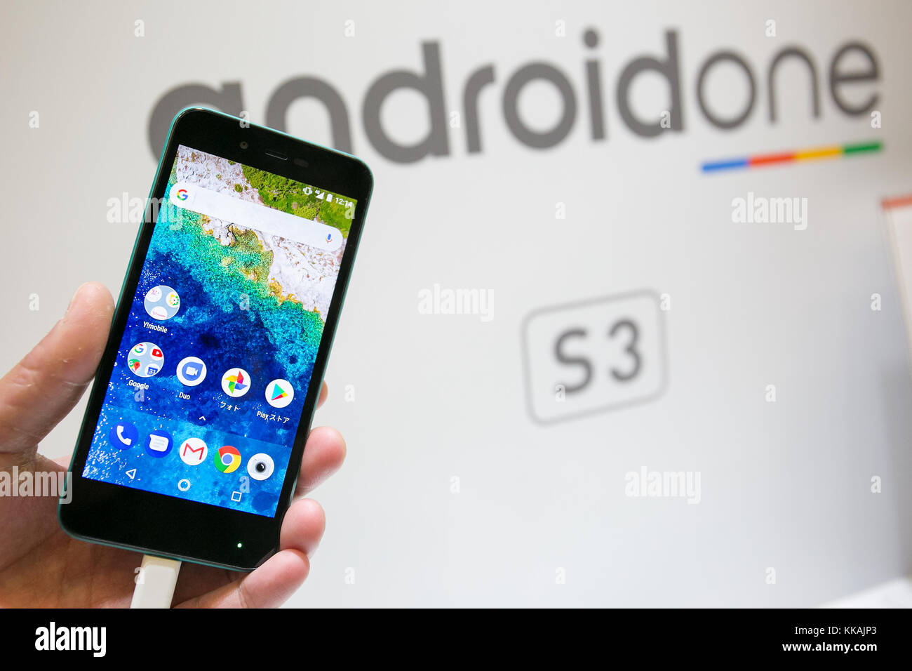 An exhibitor shows a smartphone Android One S3 during a launch event ...