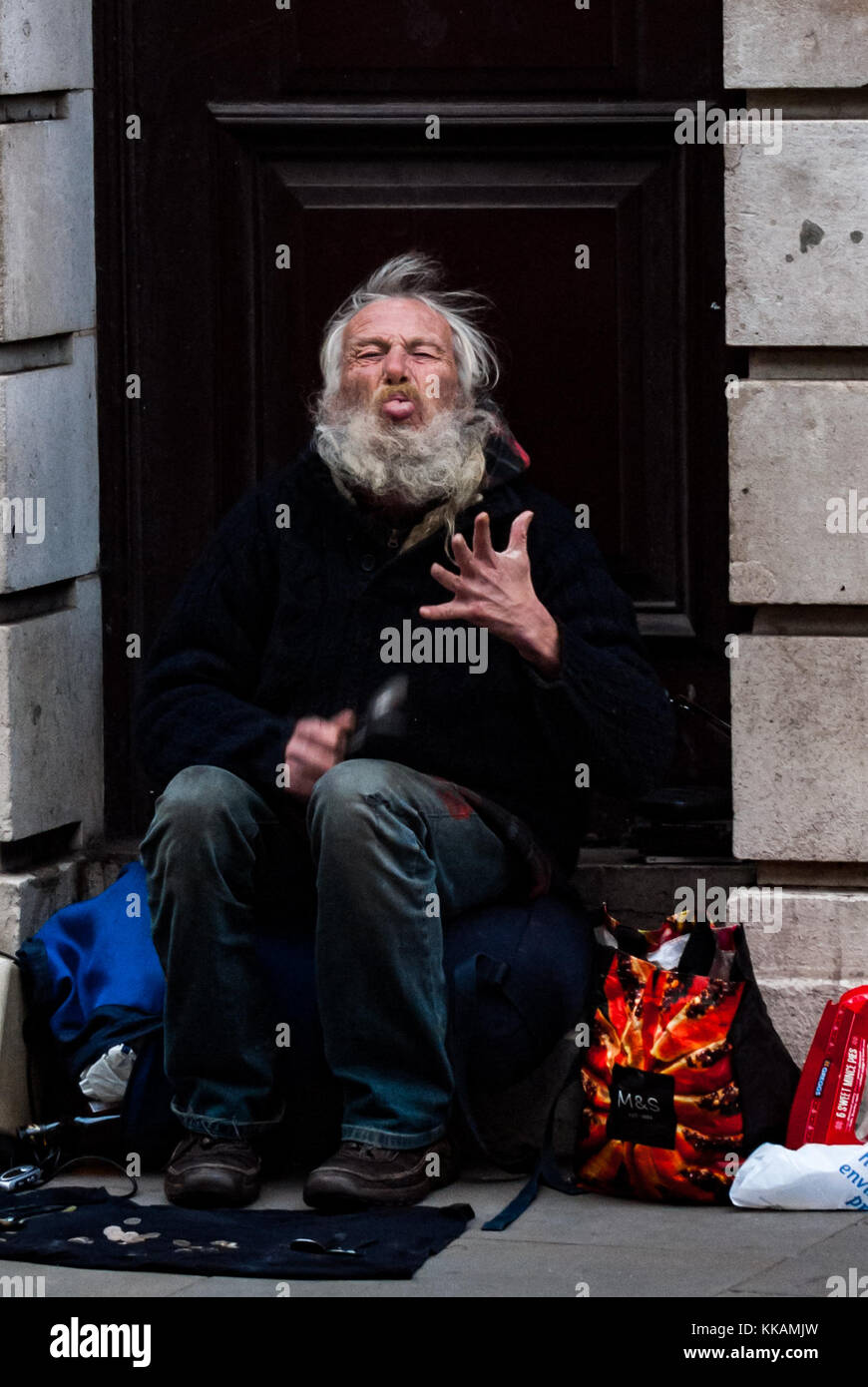 Hereford, UK. 30th Nov, 2017. A homeless man busks playing the spoons ...
