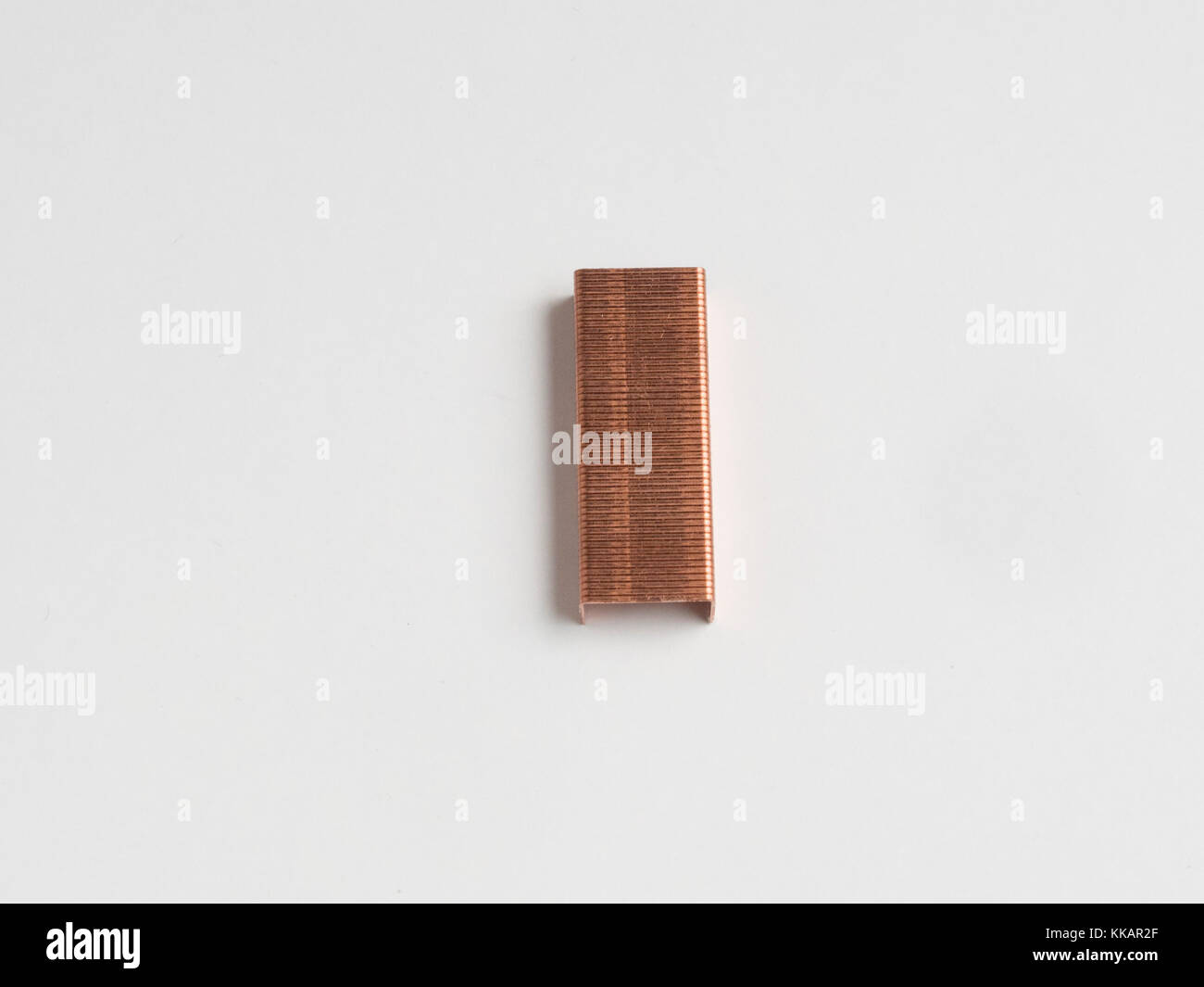 Staples on white background Stock Photo - Alamy