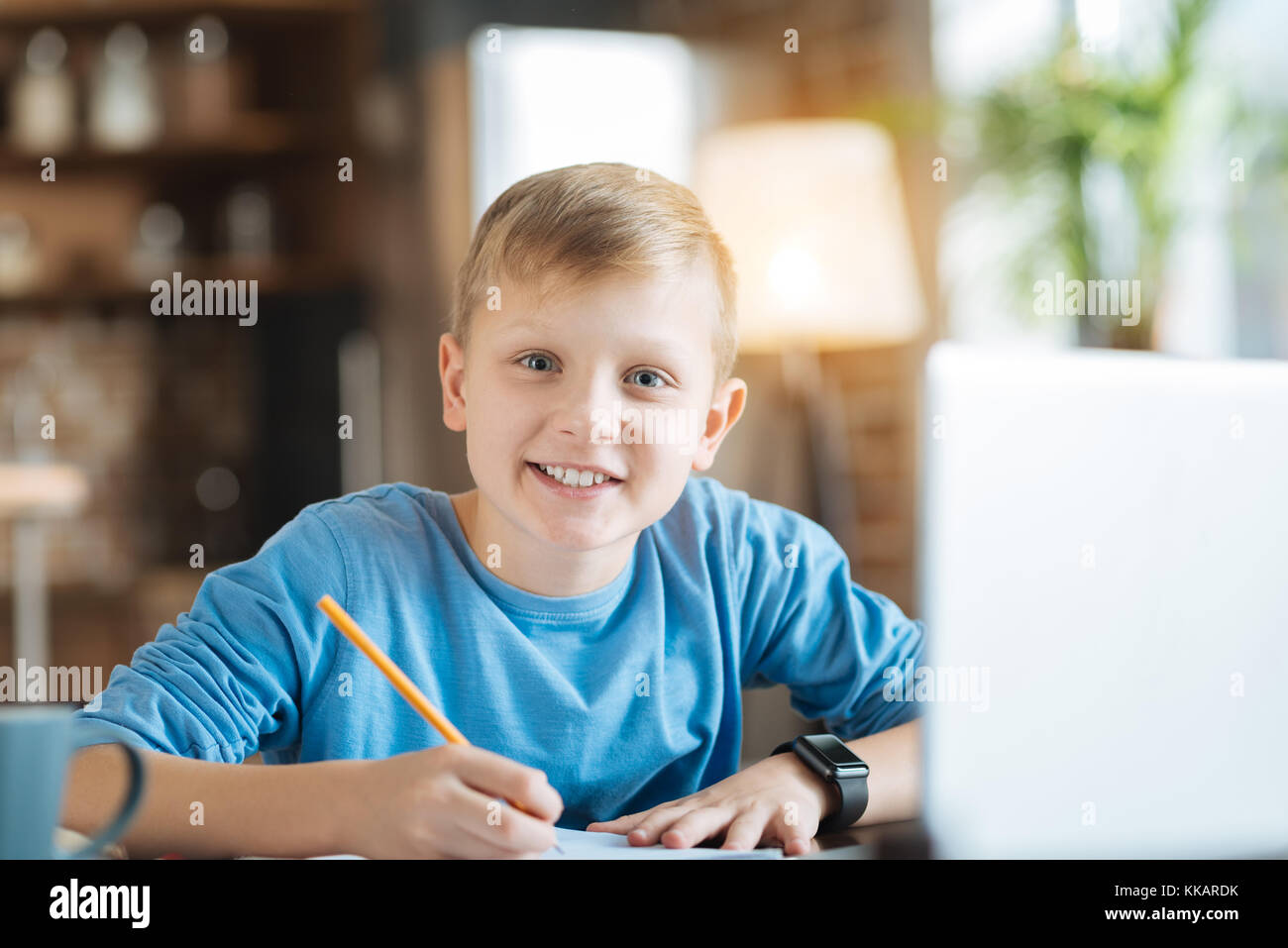 Happy delighted boy looking at you Stock Photo - Alamy