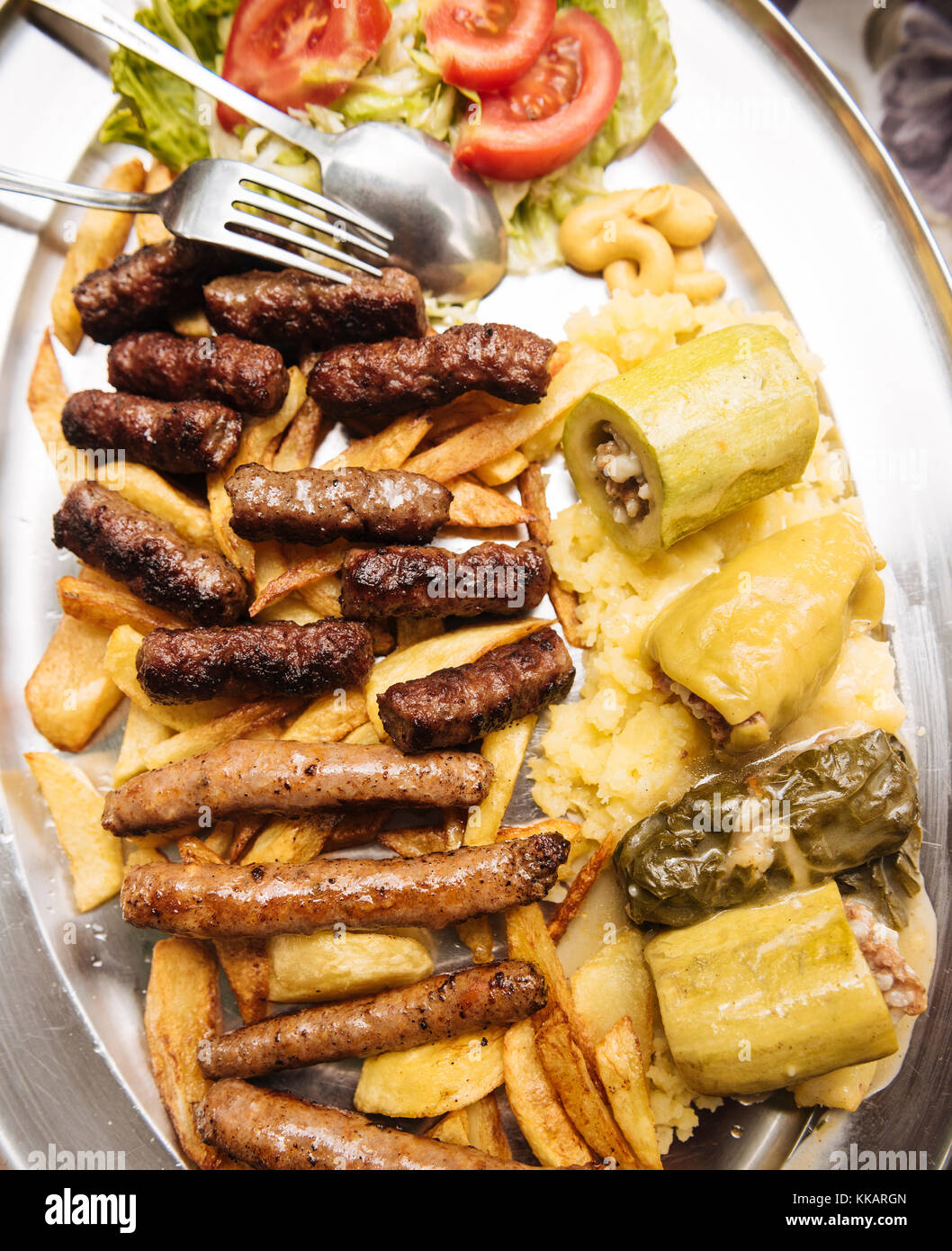 Traditional dish of cevapi and sausages, Mostar, Bosnia and Hercegovina ...