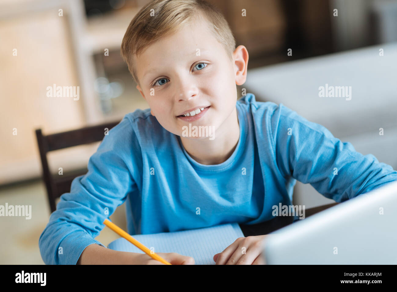 Positive cheerful boy looking at you Stock Photo - Alamy