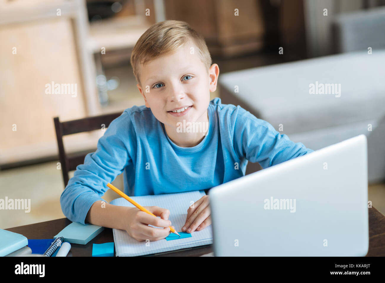 Happy delighted boy studying Stock Photo - Alamy