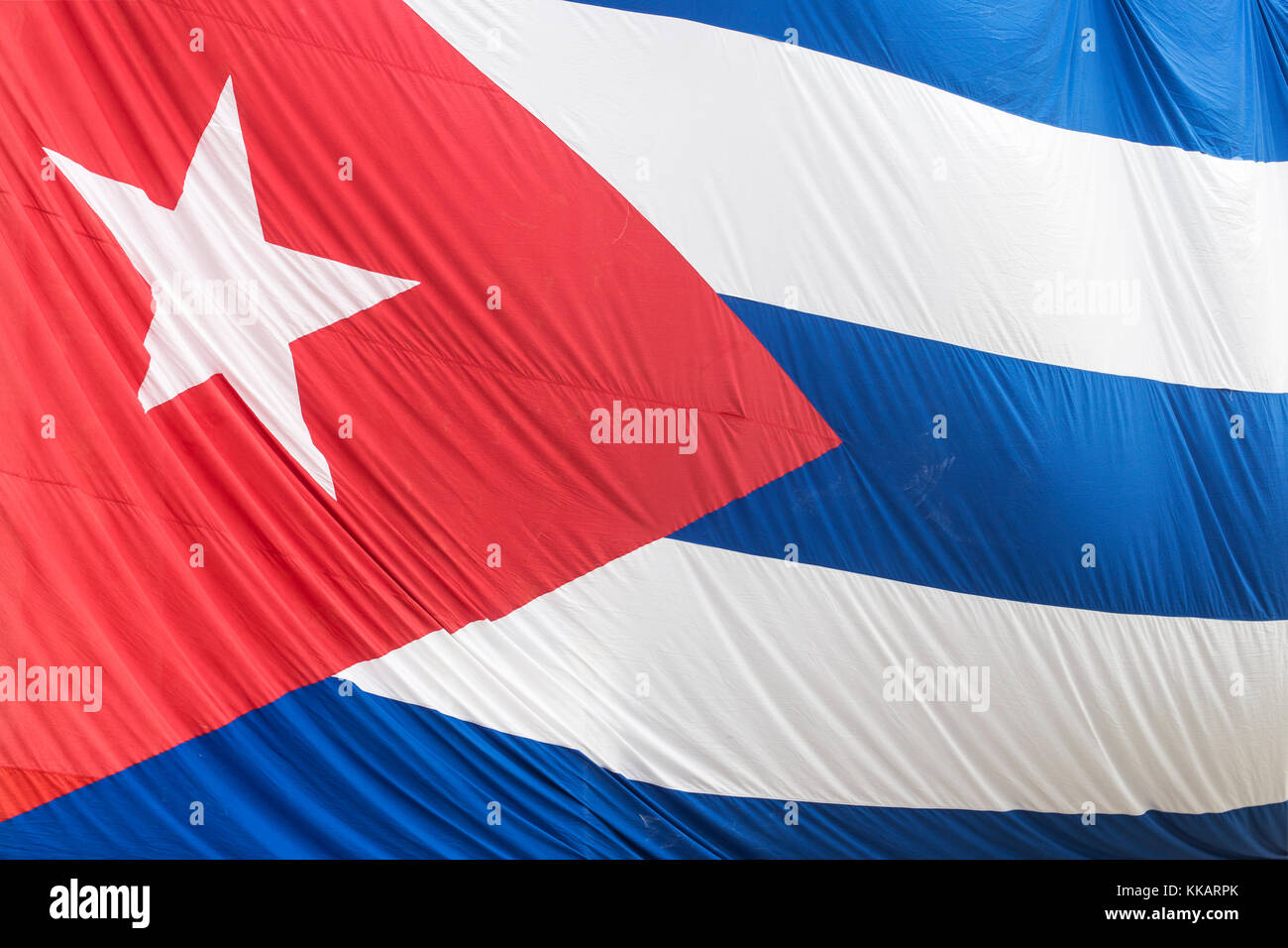 Cuban flag hanging across buildings in a street in Santa Clara, after ...